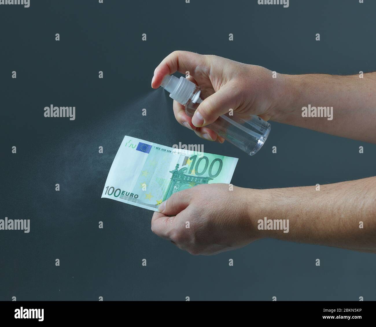 disinfection of money, banknote of 100 euros Stock Photo - Alamy