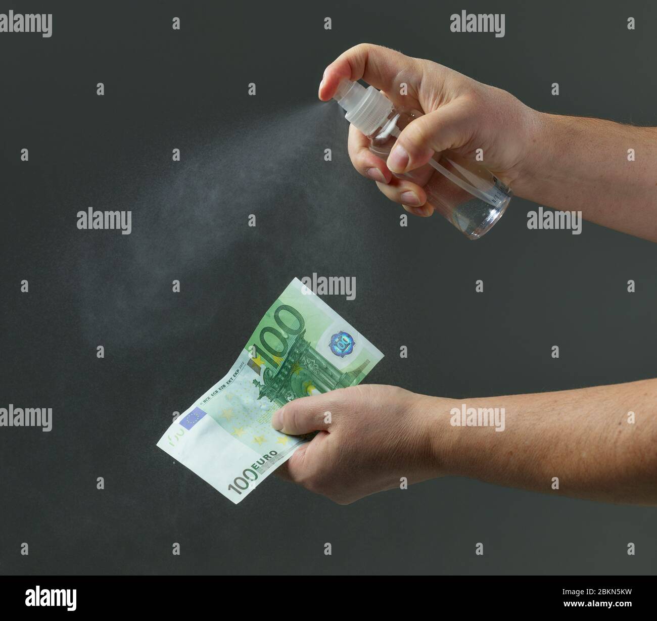 disinfection of money, banknote of 100 euros Stock Photo - Alamy