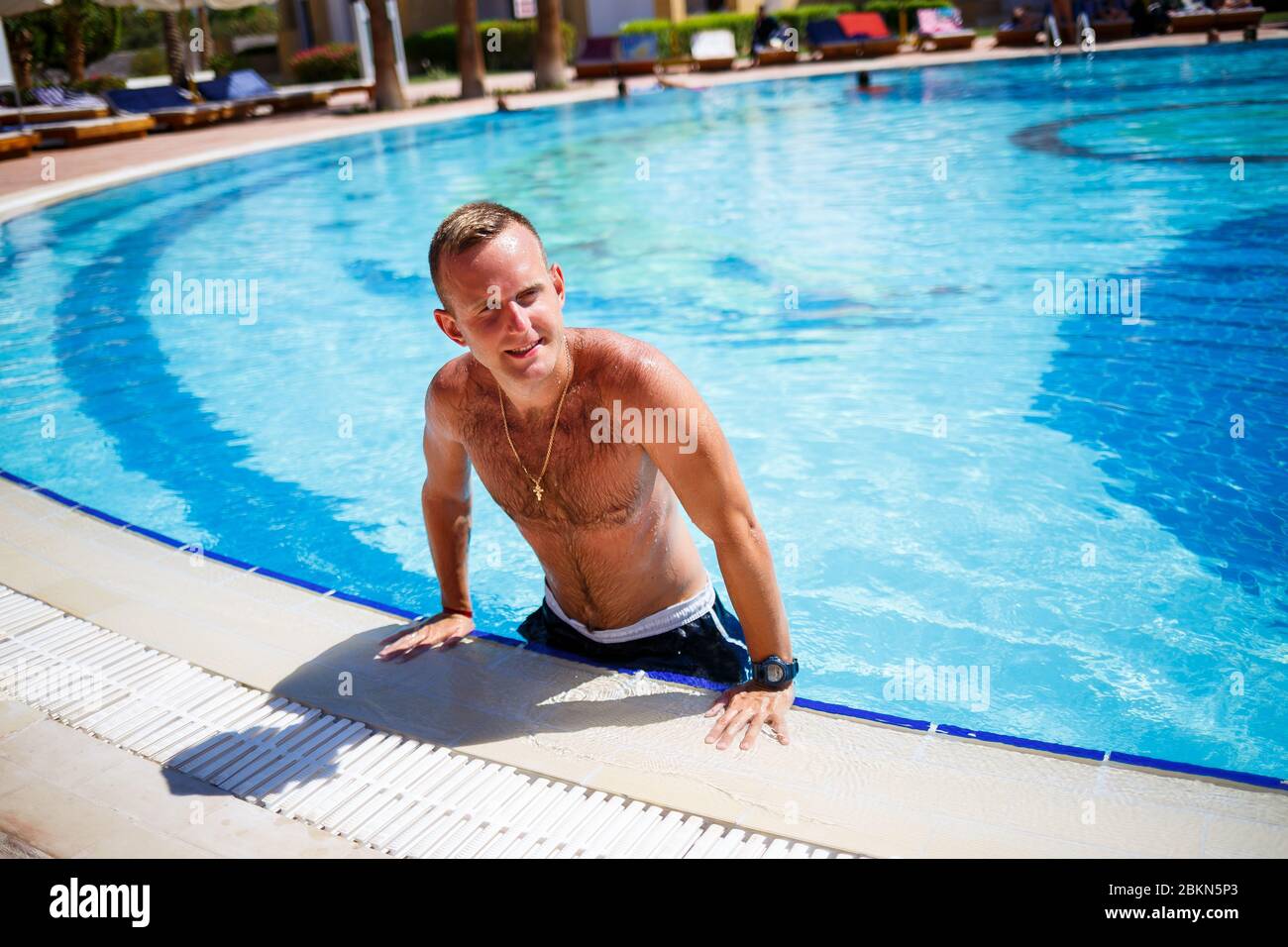 Man swimming pool outdoors muscles hi-res stock photography and images ...