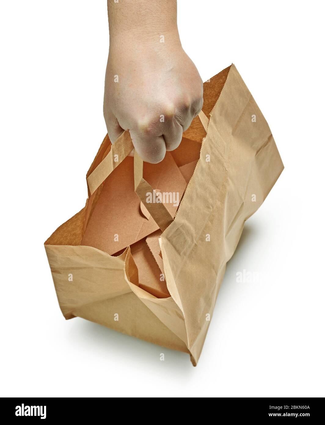 paper bag in human hand isolated on white background. Food delivery ...