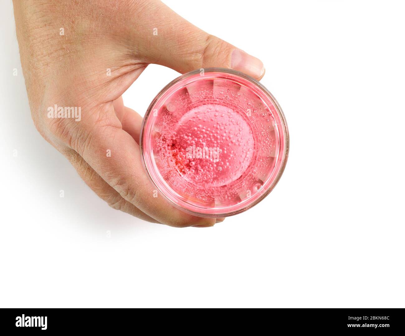 glass of pink lemonade in human hand, top view Stock Photo - Alamy