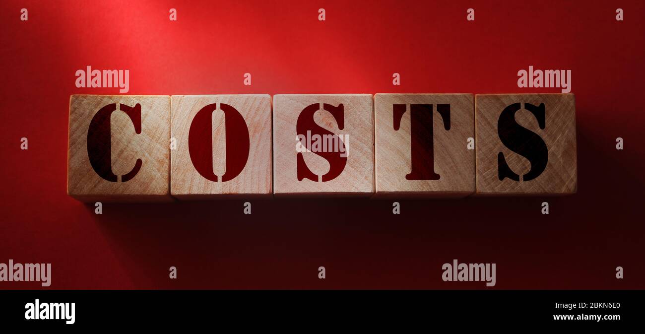 Costs word on wooden blocks with letters on red background. Business ...