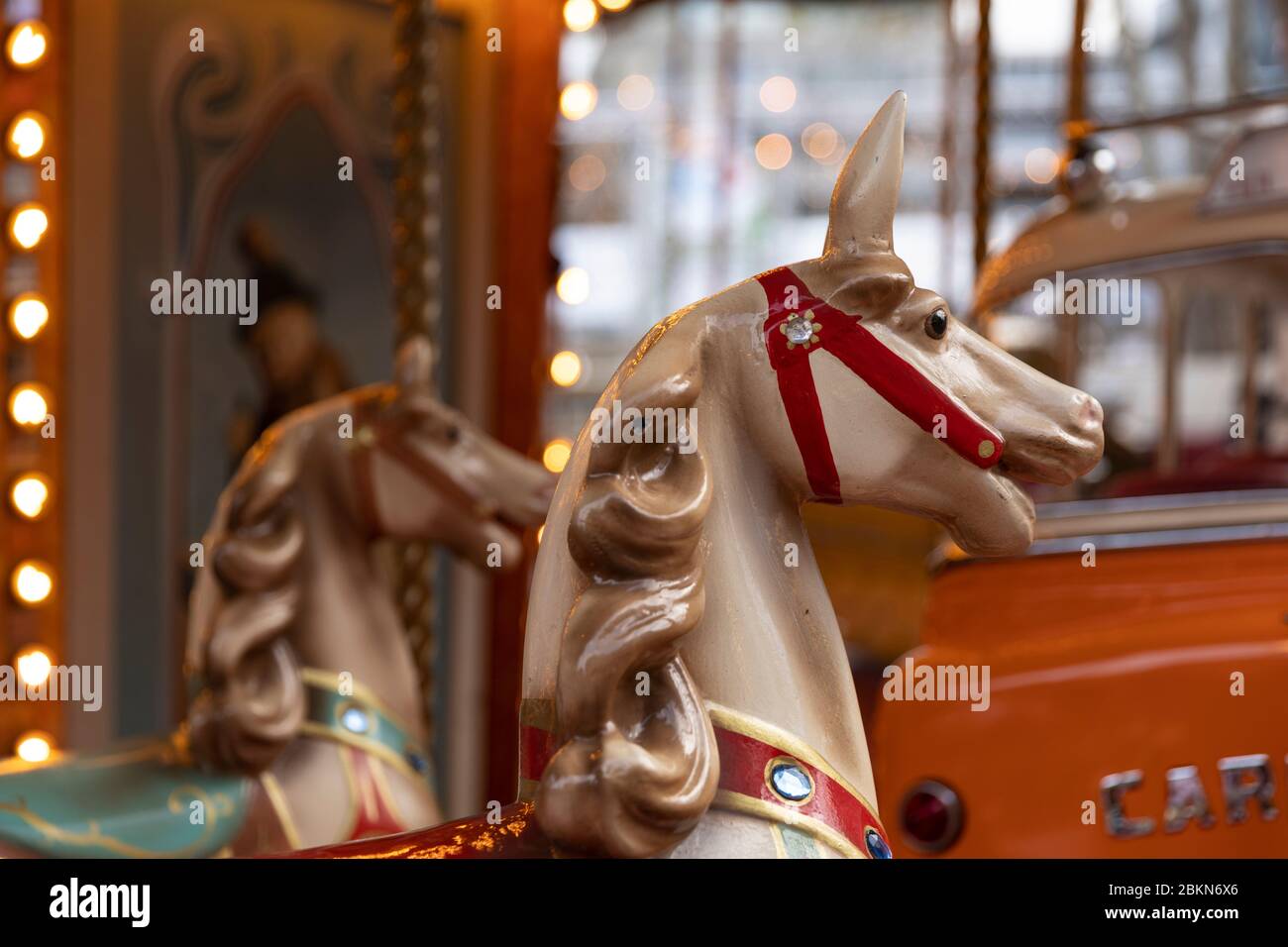 A head of an old vintage horse carousel ride in the city center of ...