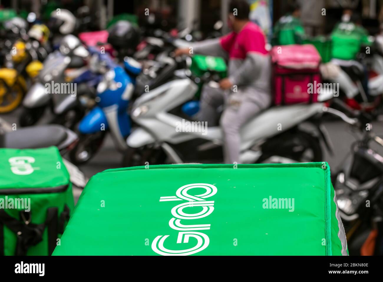 Grab food delivery motorcycle rider with face mask during Covid 19 ...