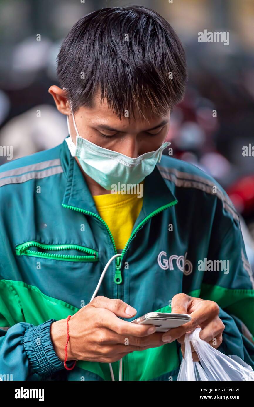 Grab food delivery motorcycle rider with face mask during Covid 19 ...