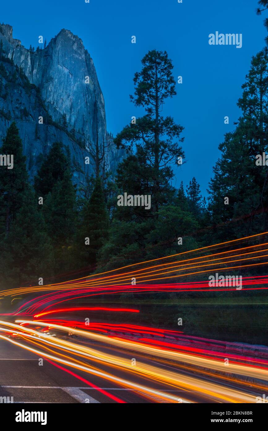 Car trail lights over Merced River bridge in Yosemite Village, Yosemite ...