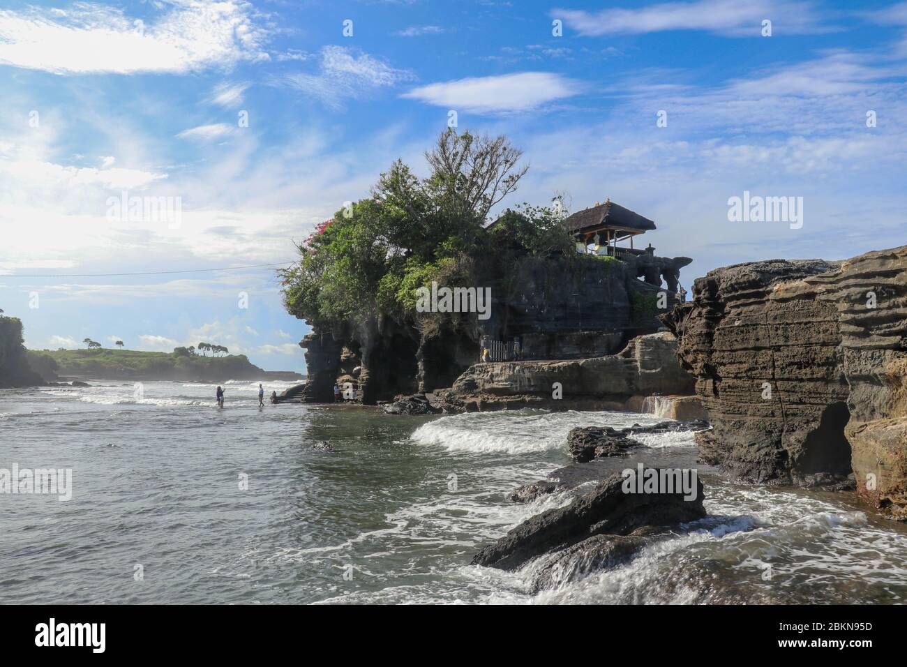 Sacred Balinese temple in Tanah Lot. Pura Batu Bolong on coastline with ...