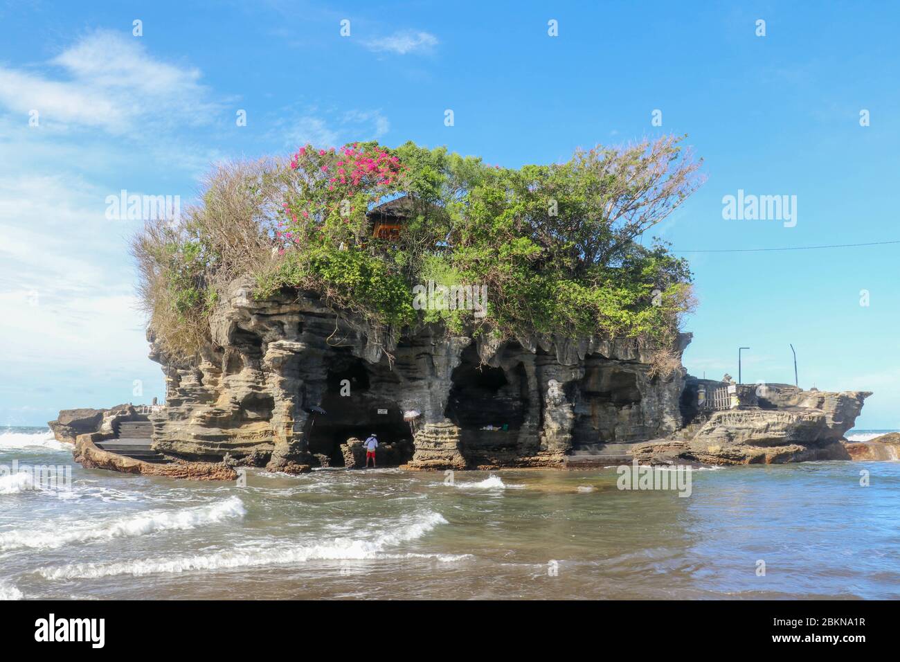 Sacred Balinese temple in Tanah Lot. Pura Batu Bolong on coastline with ...