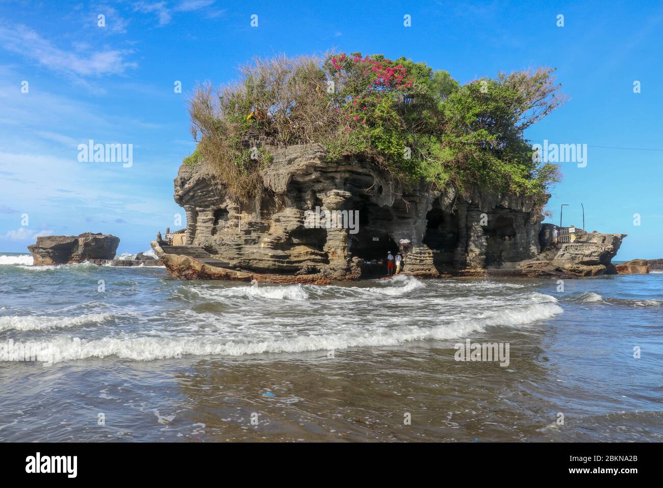 Sacred Balinese temple in Tanah Lot. Pura Batu Bolong on coastline with ...