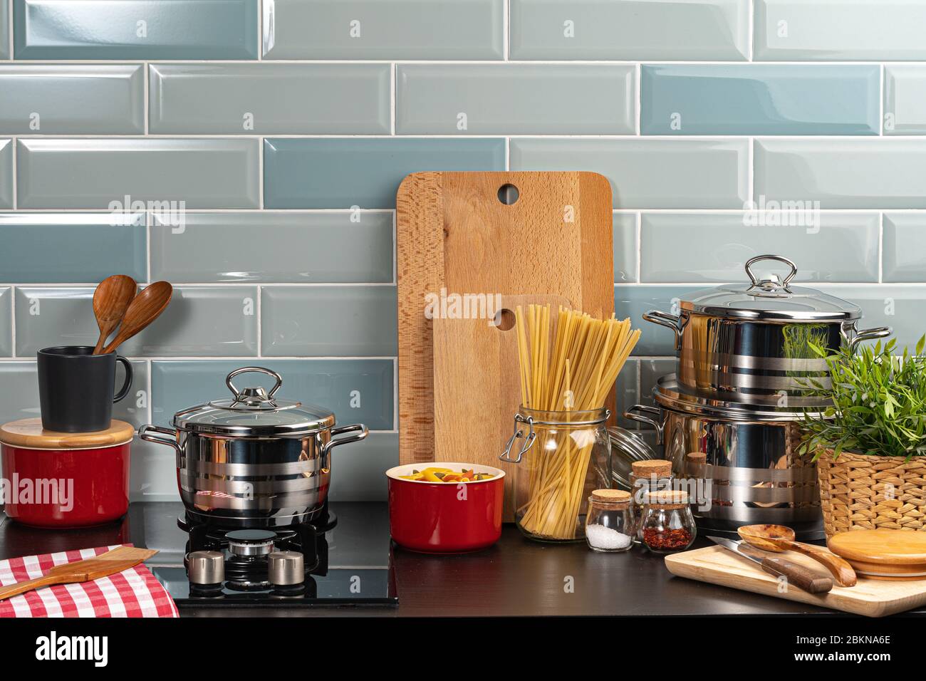 Dry spaghetti on a kitchen counter with cooking utensils Stock Photo ...