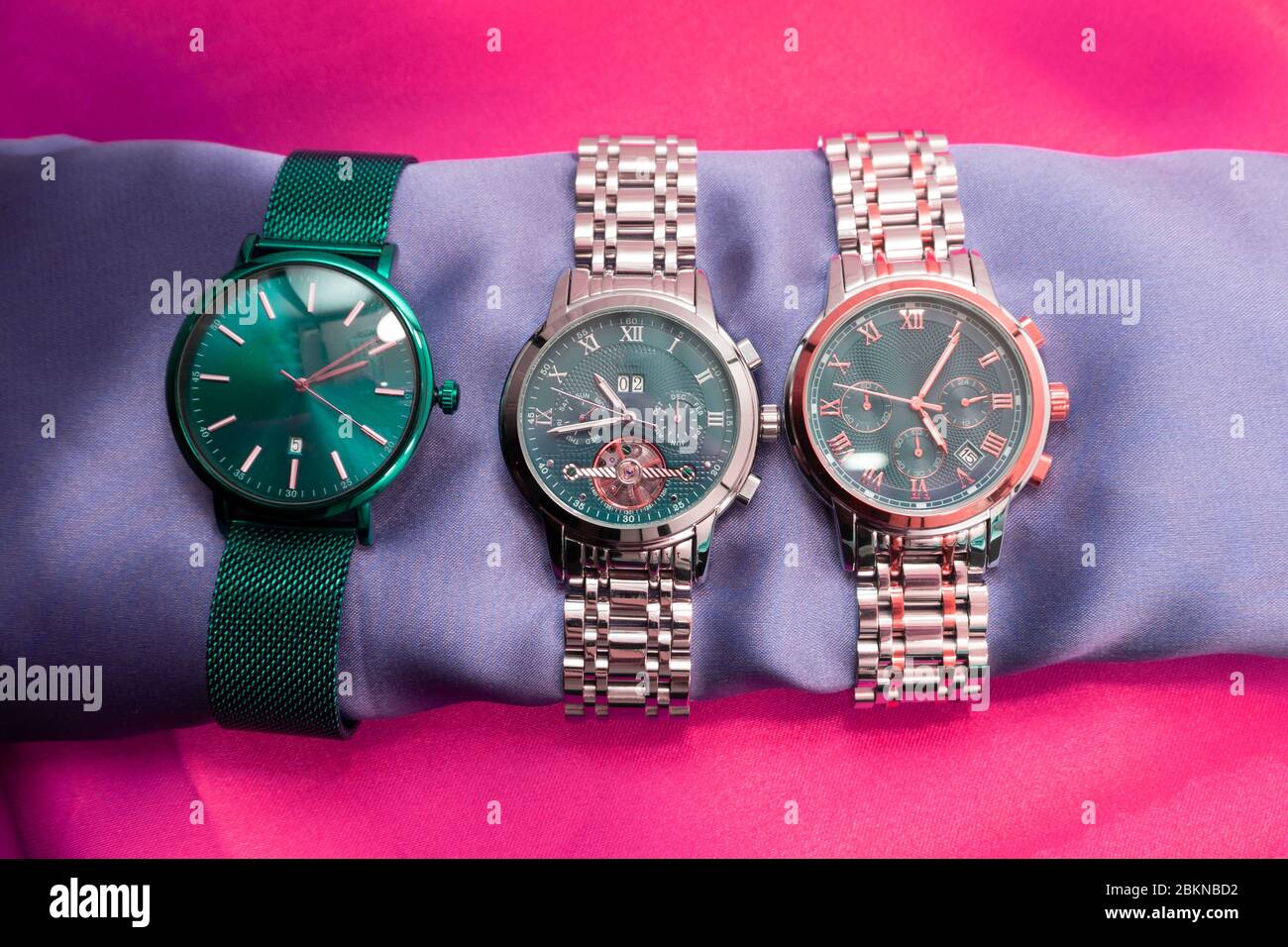 a set of three different mens watches over white Stock Photo - Alamy