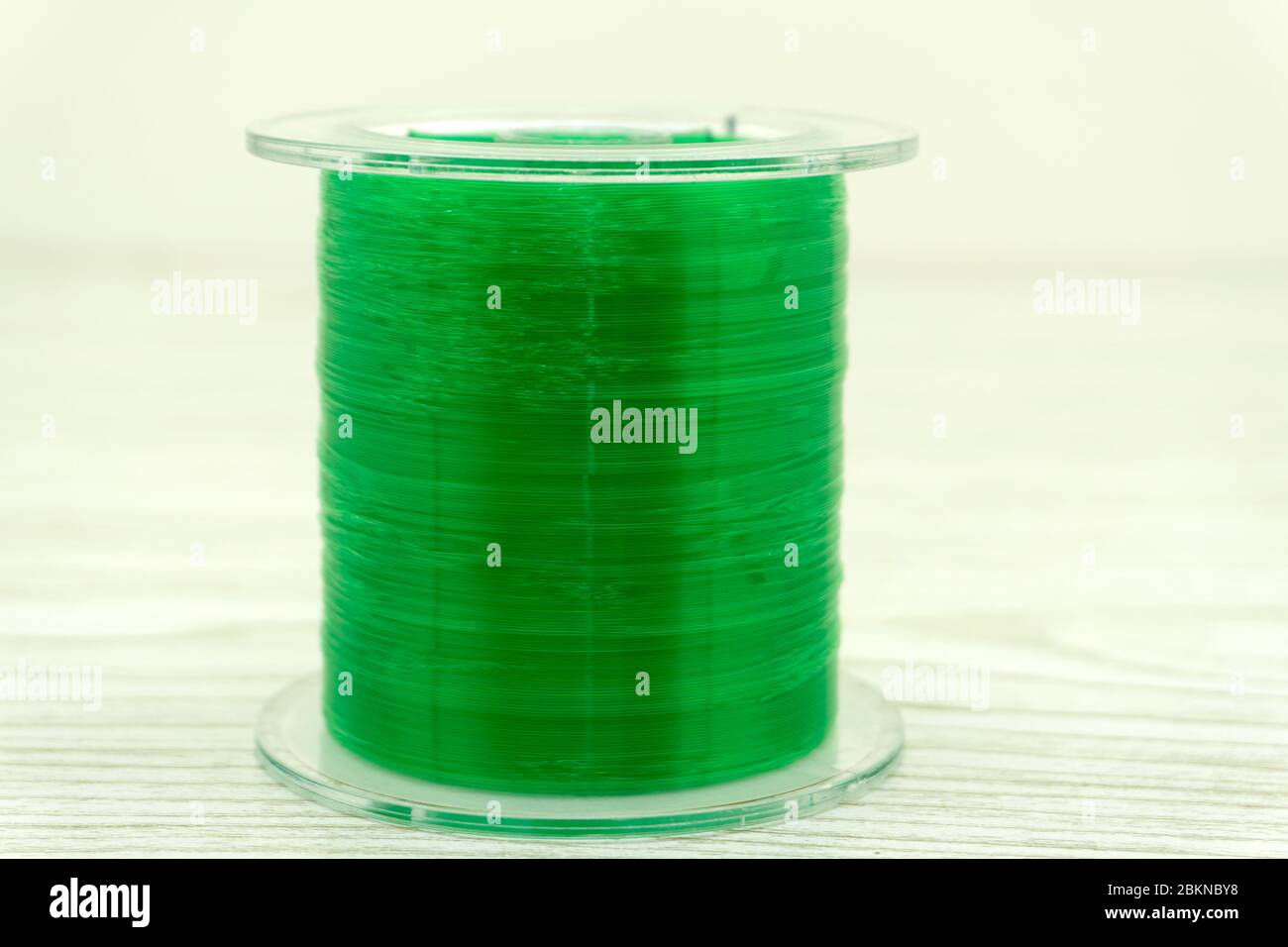 roll of nylon fishing line in color background Stock Photo - Alamy