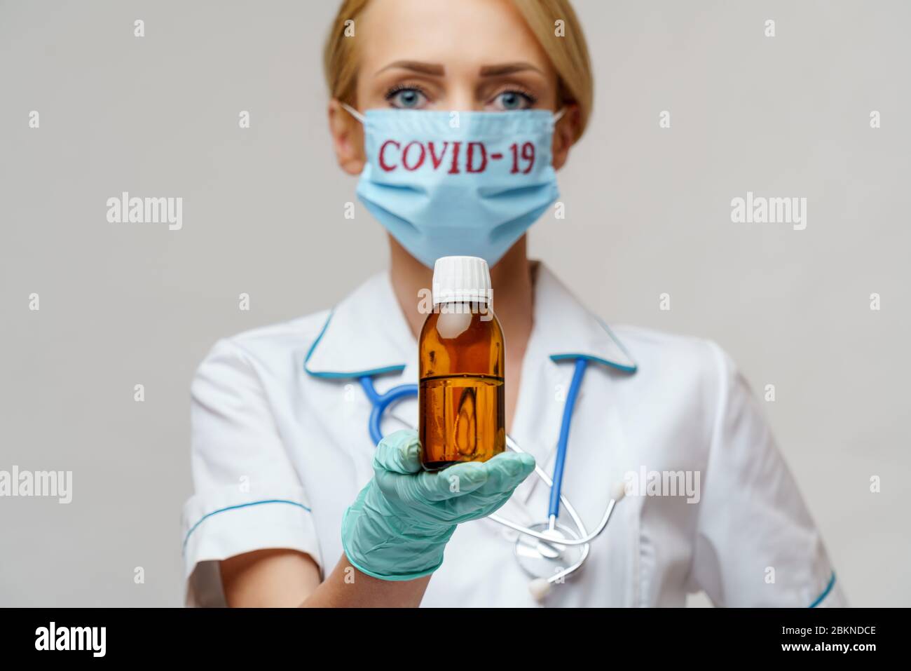 medical doctor nurse woman wearing protective mask and rubber or latex ...