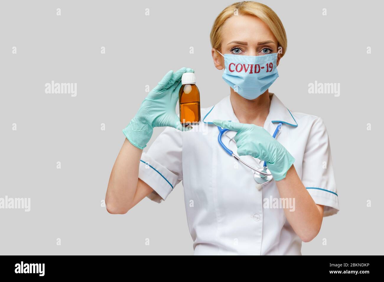 medical doctor nurse woman wearing protective mask and rubber or latex ...