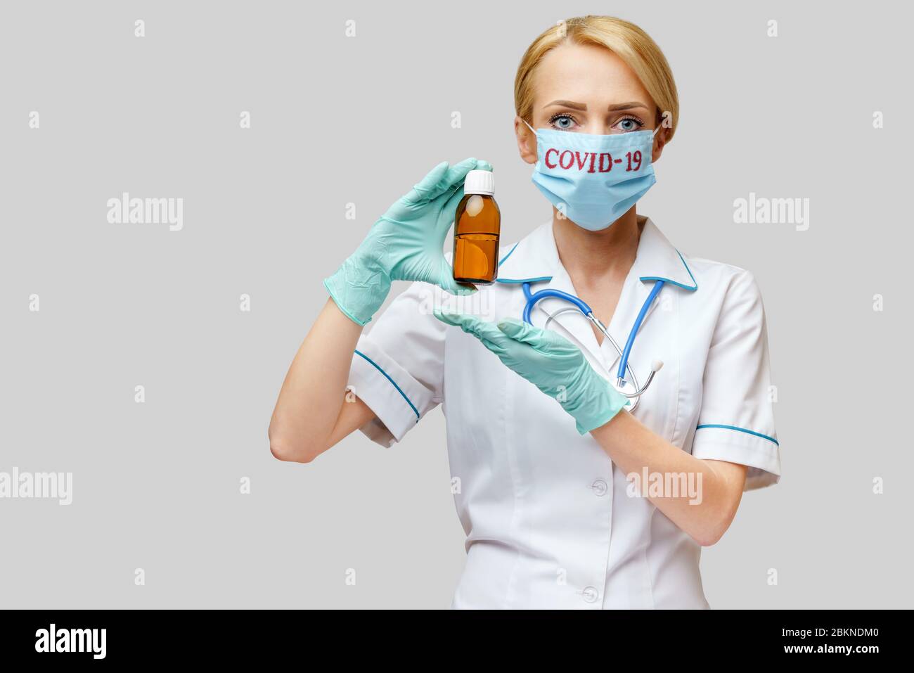 medical doctor nurse woman wearing protective mask and rubber or latex ...