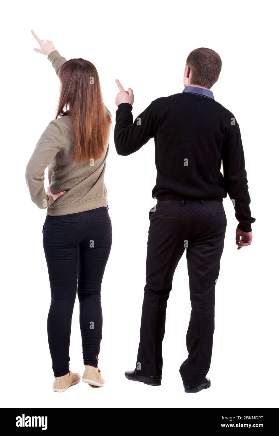 Back view of couple in sweater pointing. Rear view people collection ...