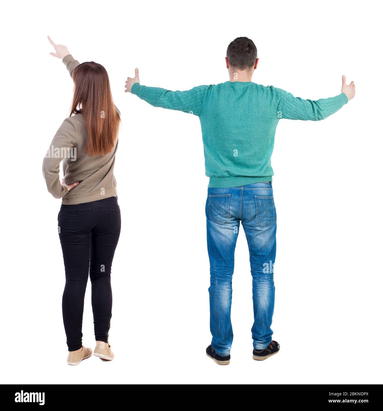 Back view of couple in sweater pointing. Rear view people collection ...