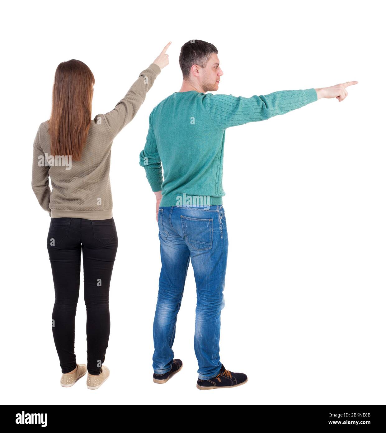 Back view of couple in sweater pointing. Rear view people collection ...