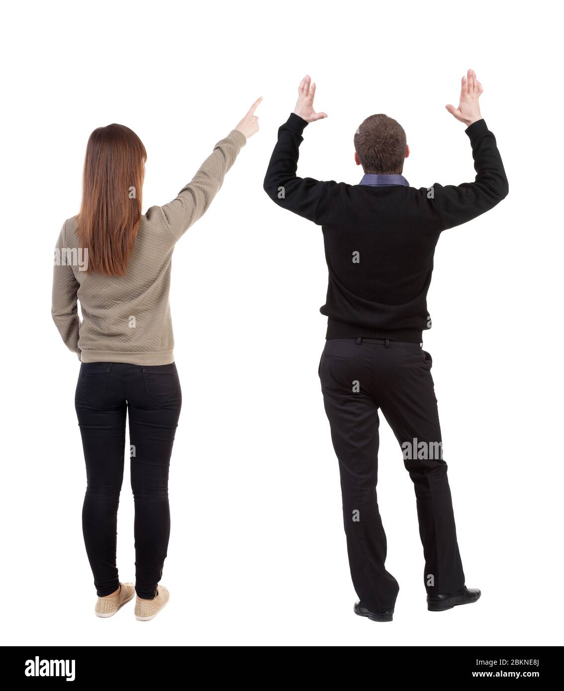 Back view of couple in sweater pointing. Rear view people collection ...