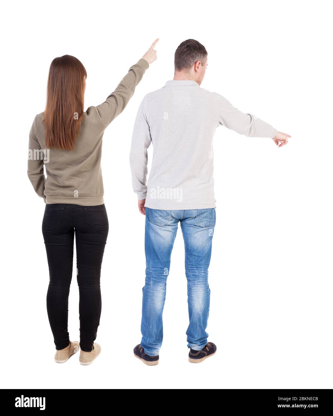 Back view of couple in sweater pointing. Rear view people collection ...