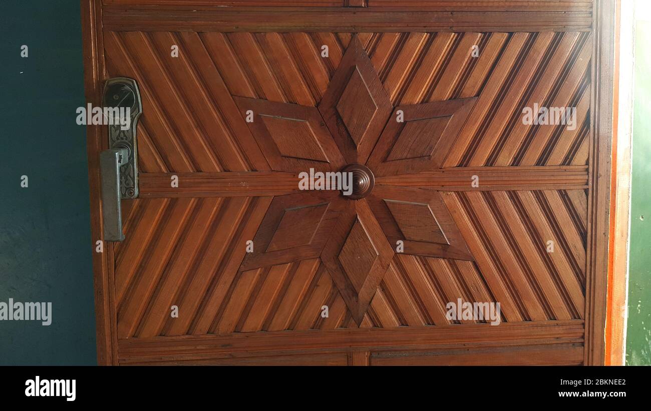 Door with parquet wooden surface and wood plank pattern of folk style ...