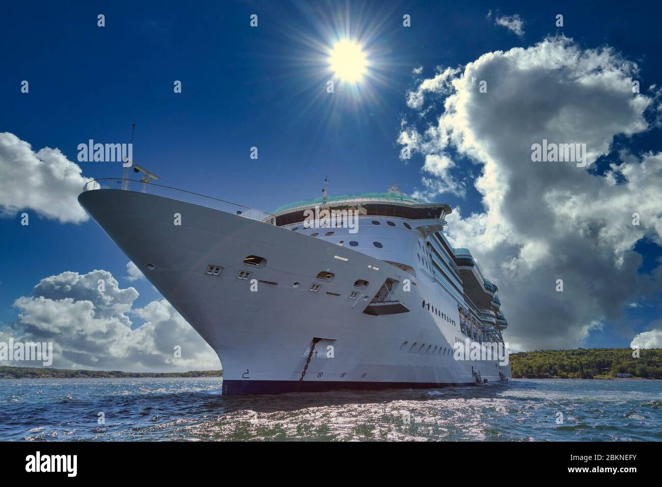 Cruise Ship Anchored Under Sun Stock Photo - Alamy