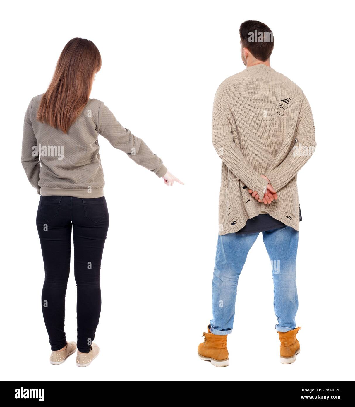 Back view of couple in sweater pointing. Rear view people collection ...