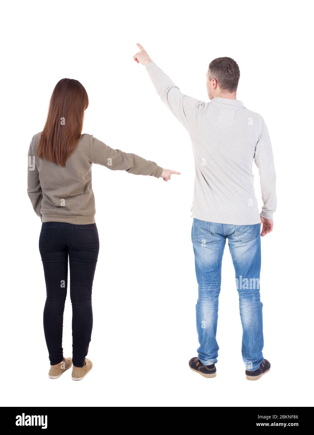 Back view of couple in sweater pointing. Rear view people collection ...