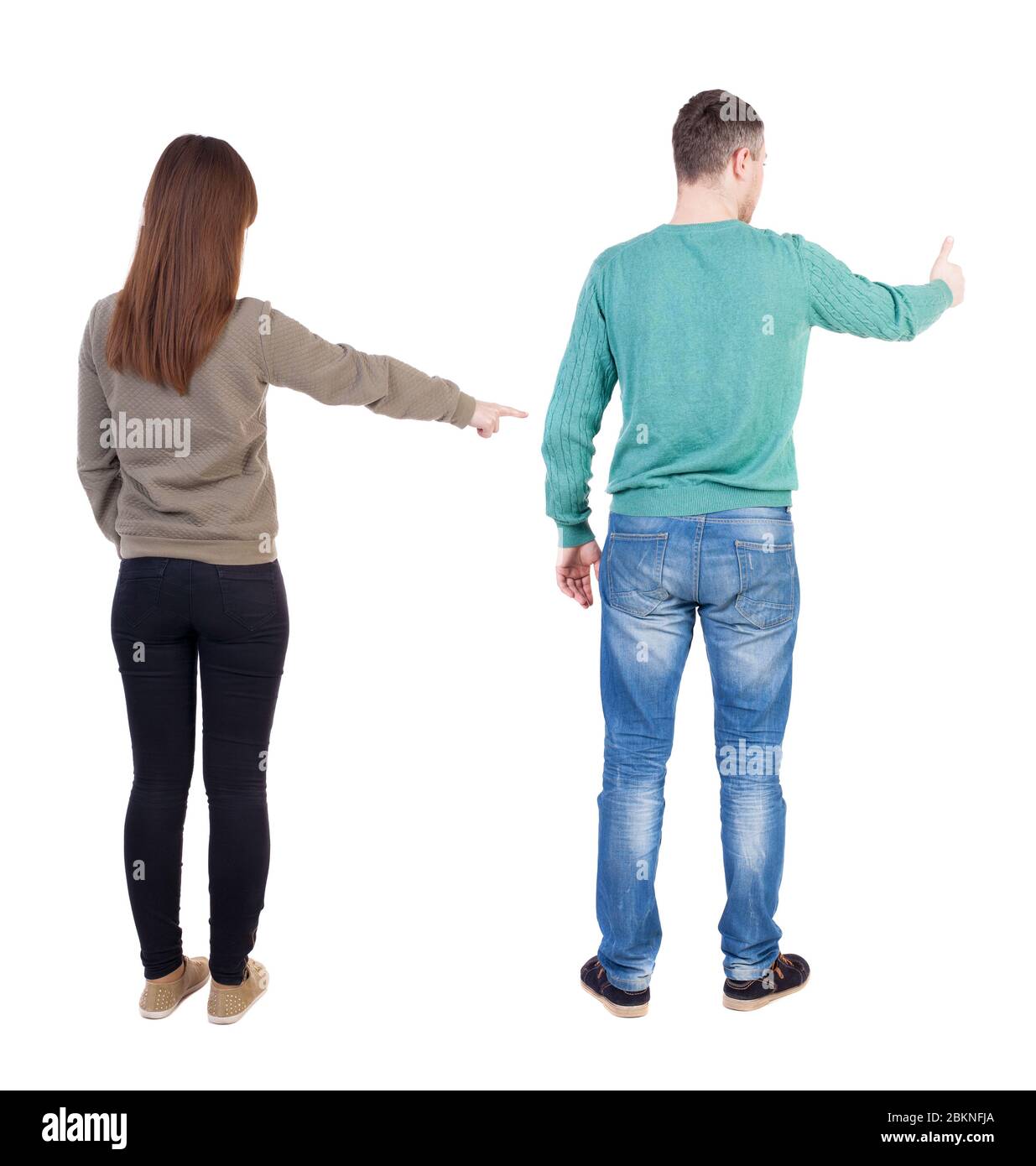 Back view of couple in sweater pointing. Rear view people collection ...