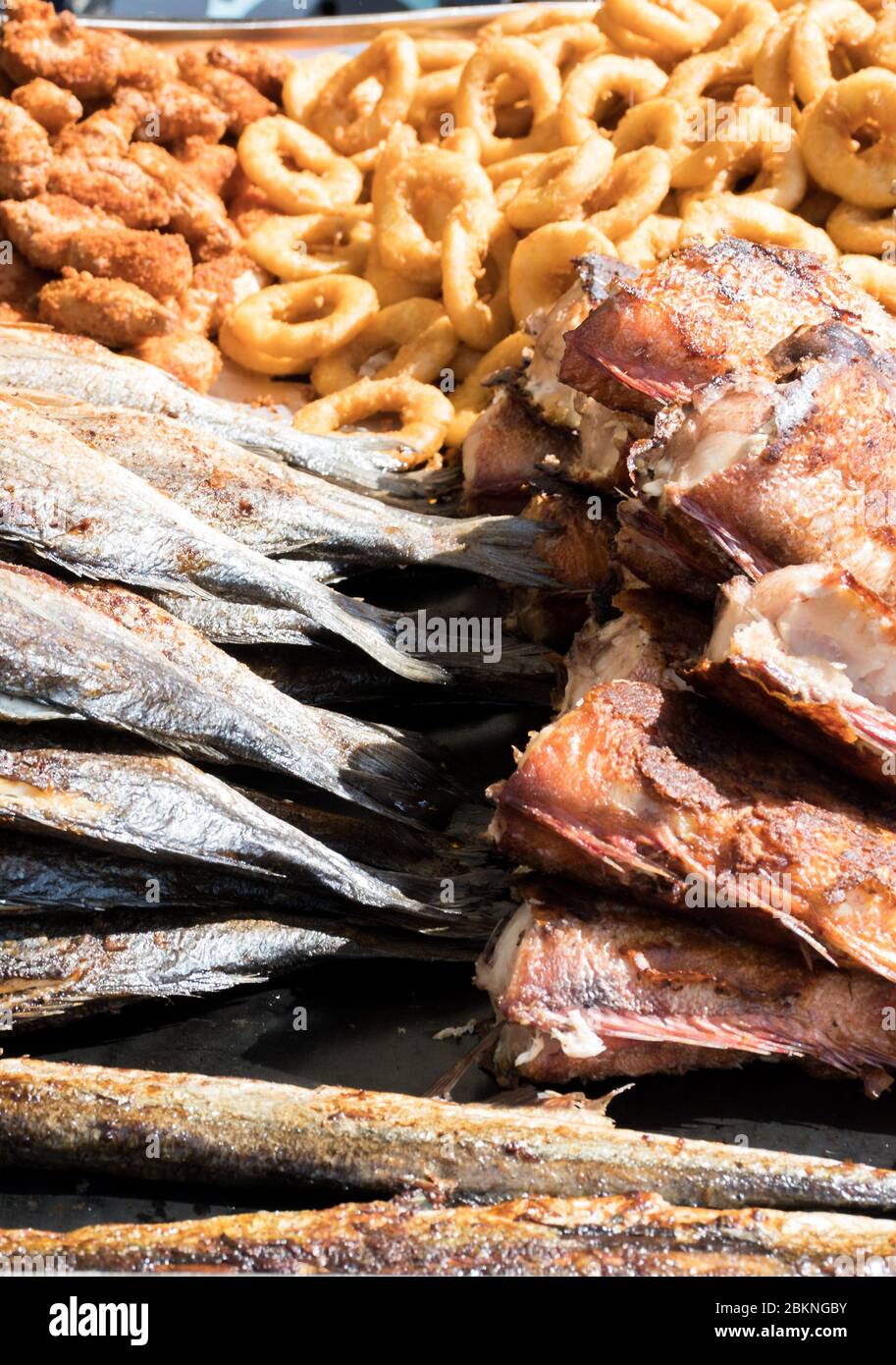 Freshly grilled fish on counter top stall, during seafood festival ...