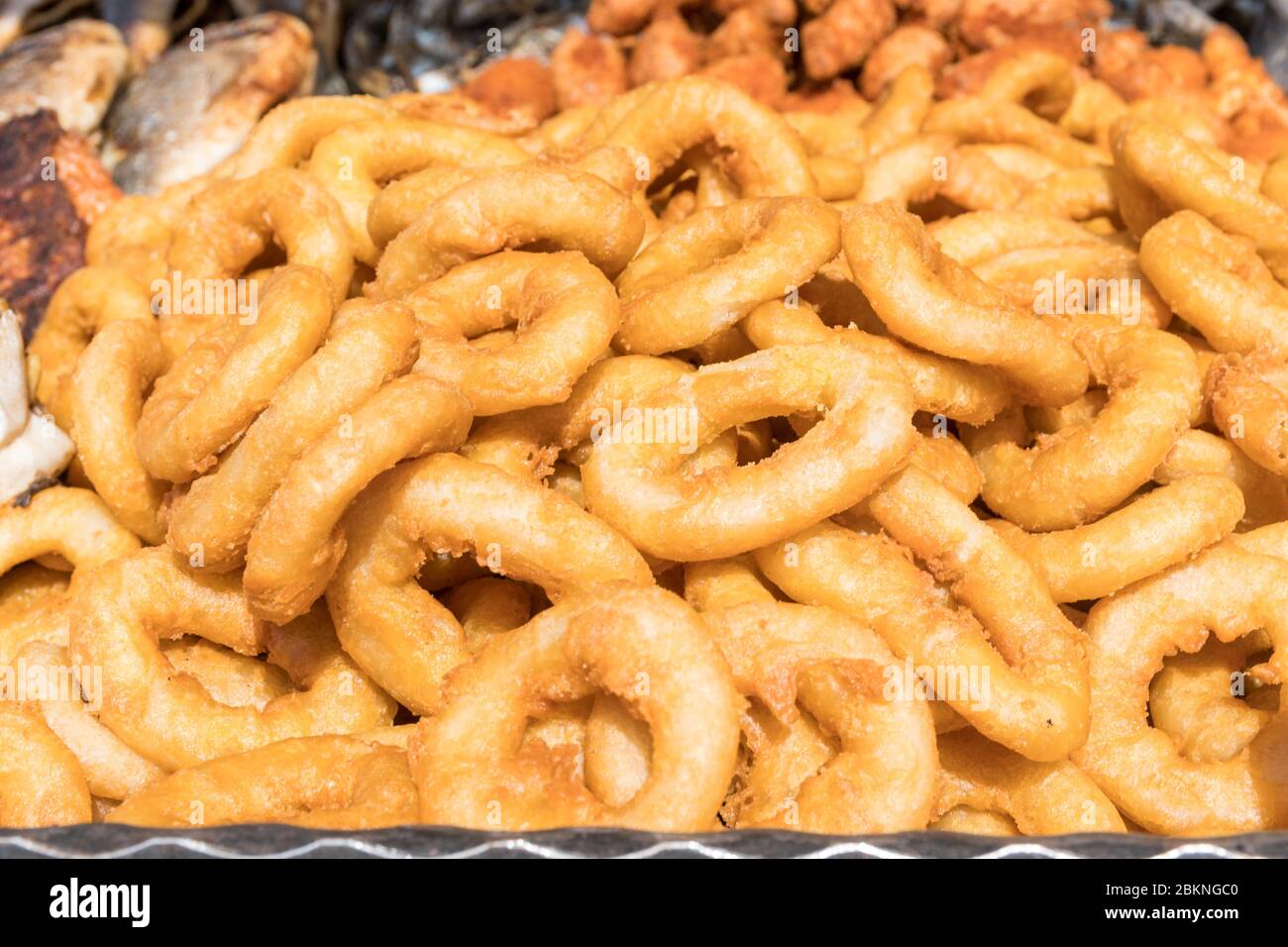 Freshly grilled fish on counter top stall, during seafood festival ...