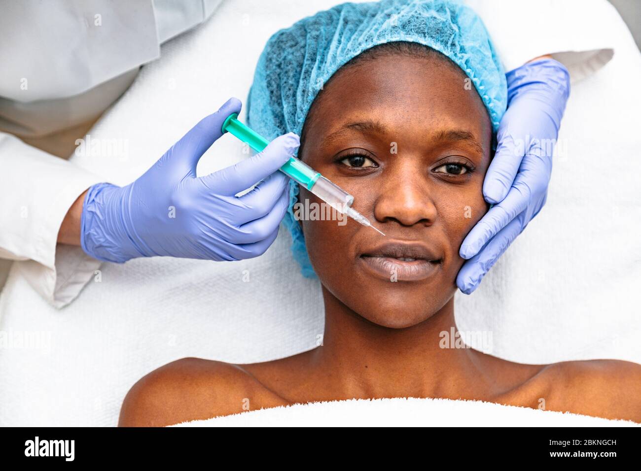 Cosmetic beauty injection to beautiful woman face Stock Photo - Alamy