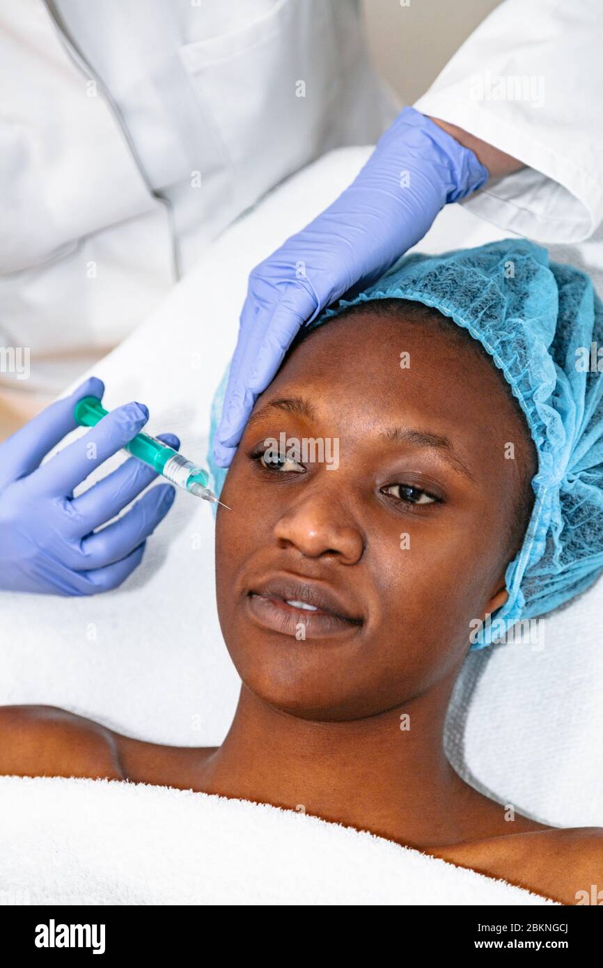 Cosmetic beauty injection to beautiful woman face Stock Photo - Alamy