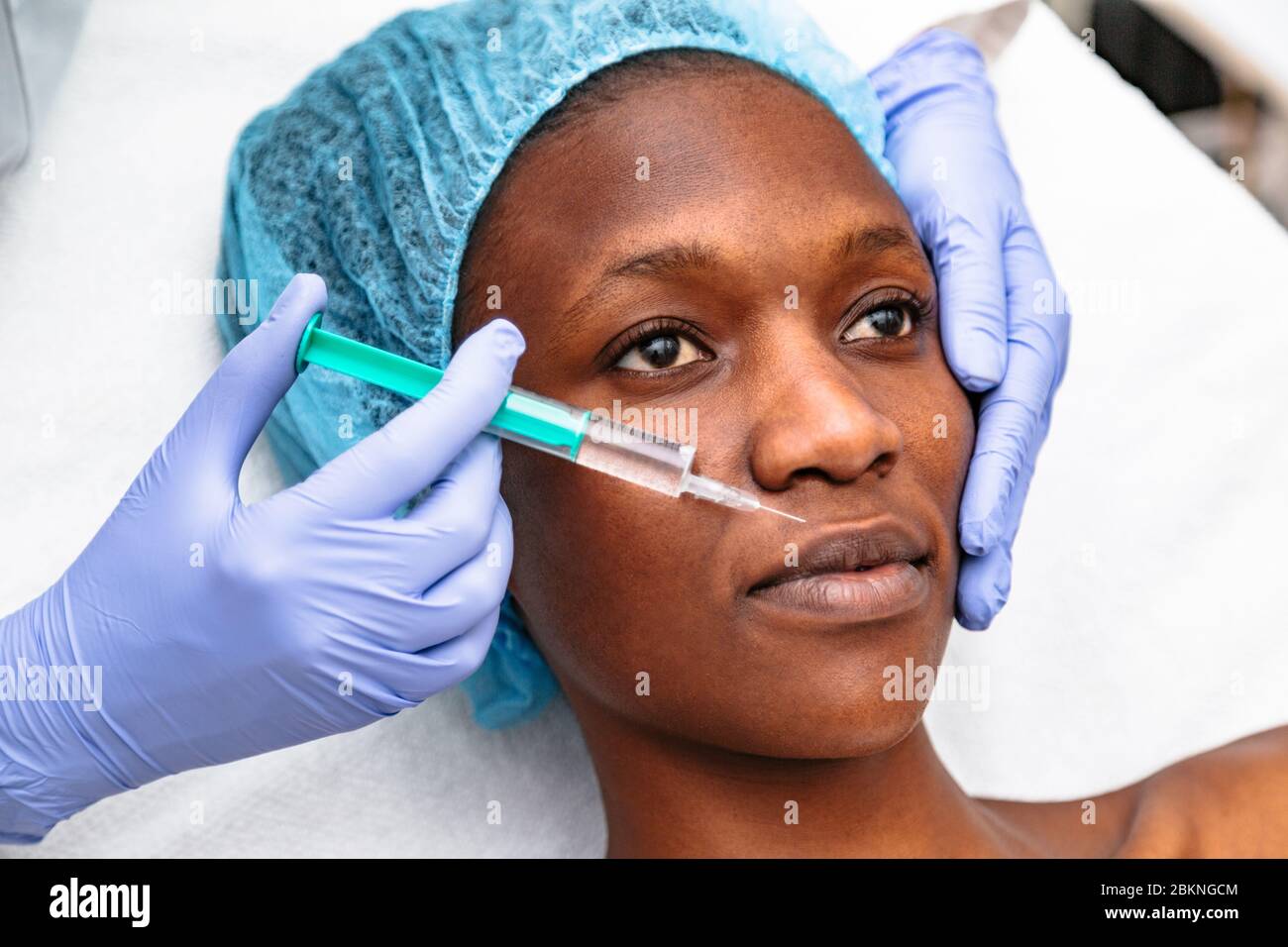 Cosmetic beauty injection to beautiful woman face Stock Photo - Alamy