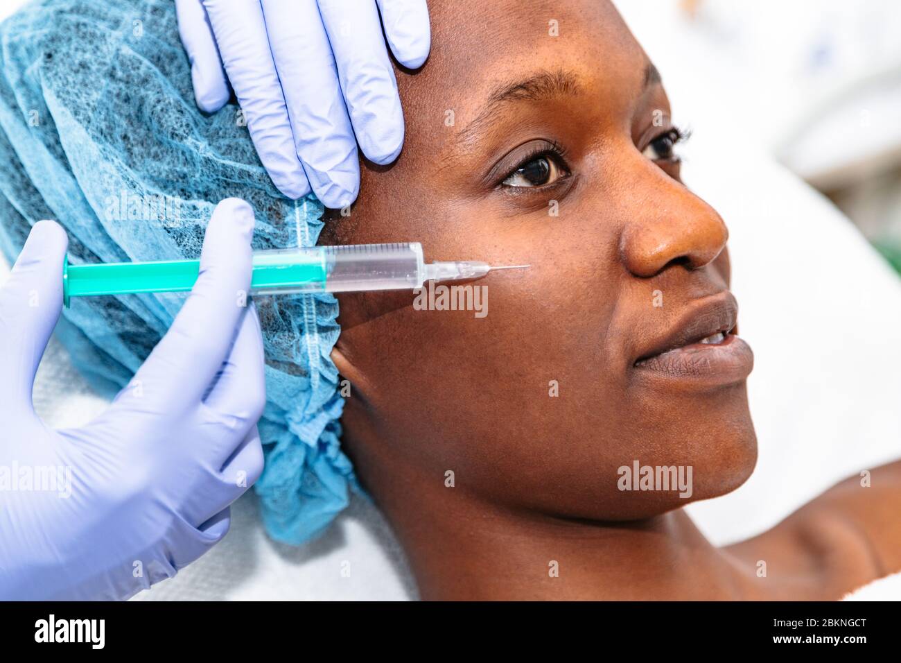 Woman receiving beauty plastic injection on her nose Stock Photo - Alamy