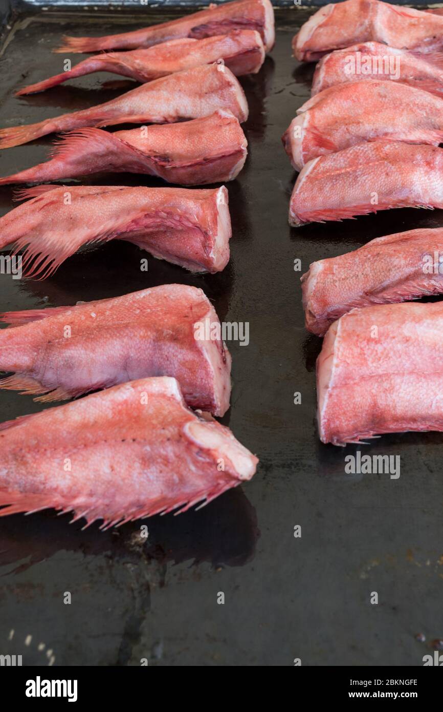 Fresh raw fish on grill slate, during seafood festival, street food ...