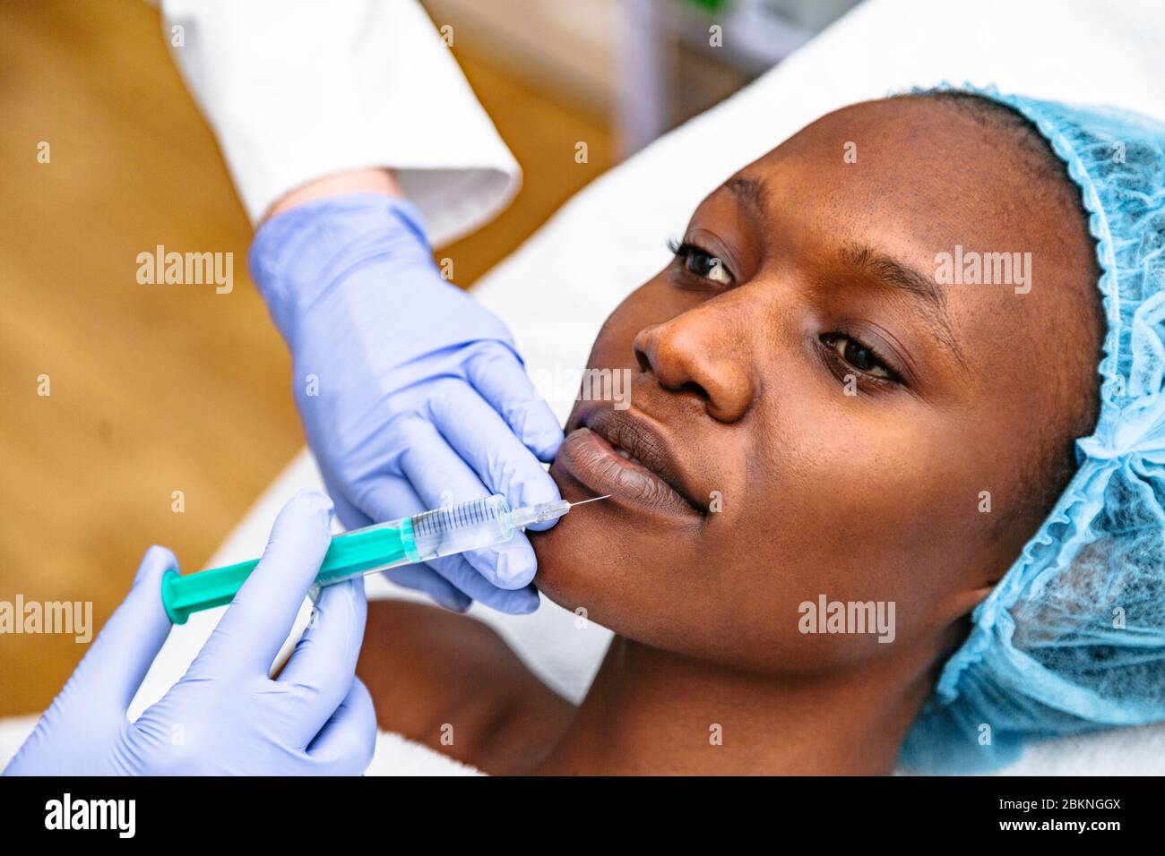 Cosmetic beauty injection to beautiful woman face Stock Photo - Alamy