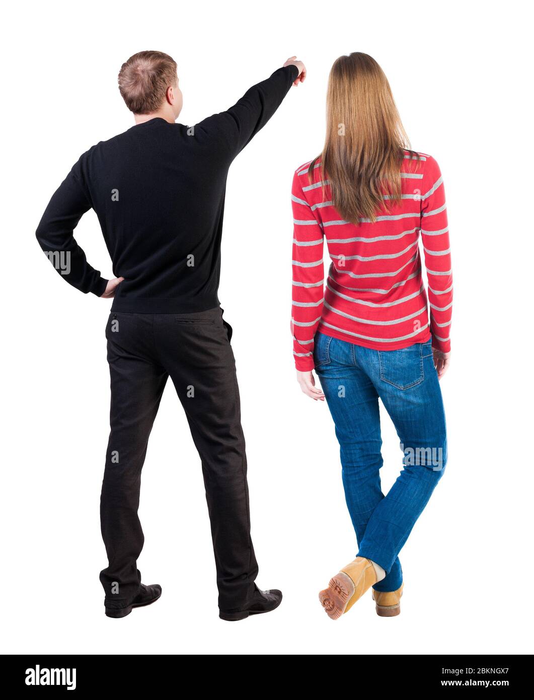 Back view of couple in sweater pointing. Rear view people collection ...