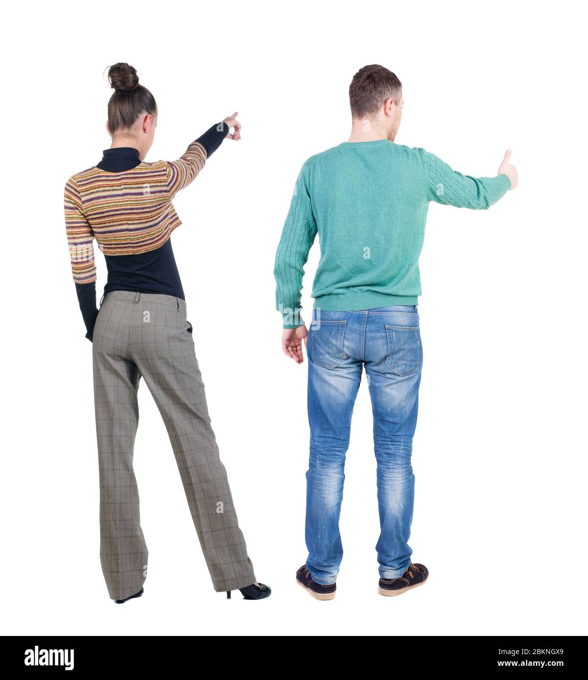Back view of couple in sweater pointing. Rear view people collection ...
