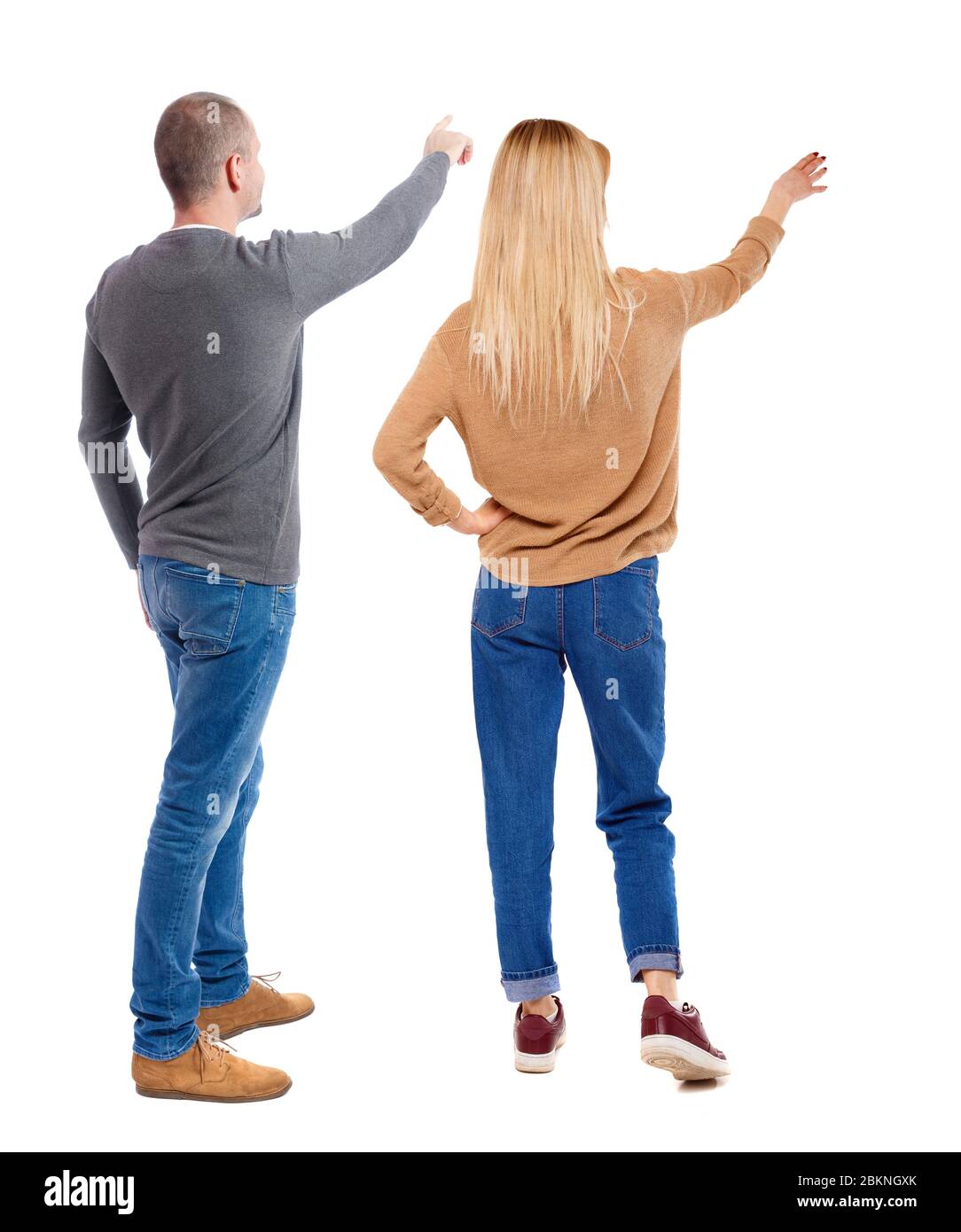 Back view of couple in sweater pointing. Rear view people collection ...