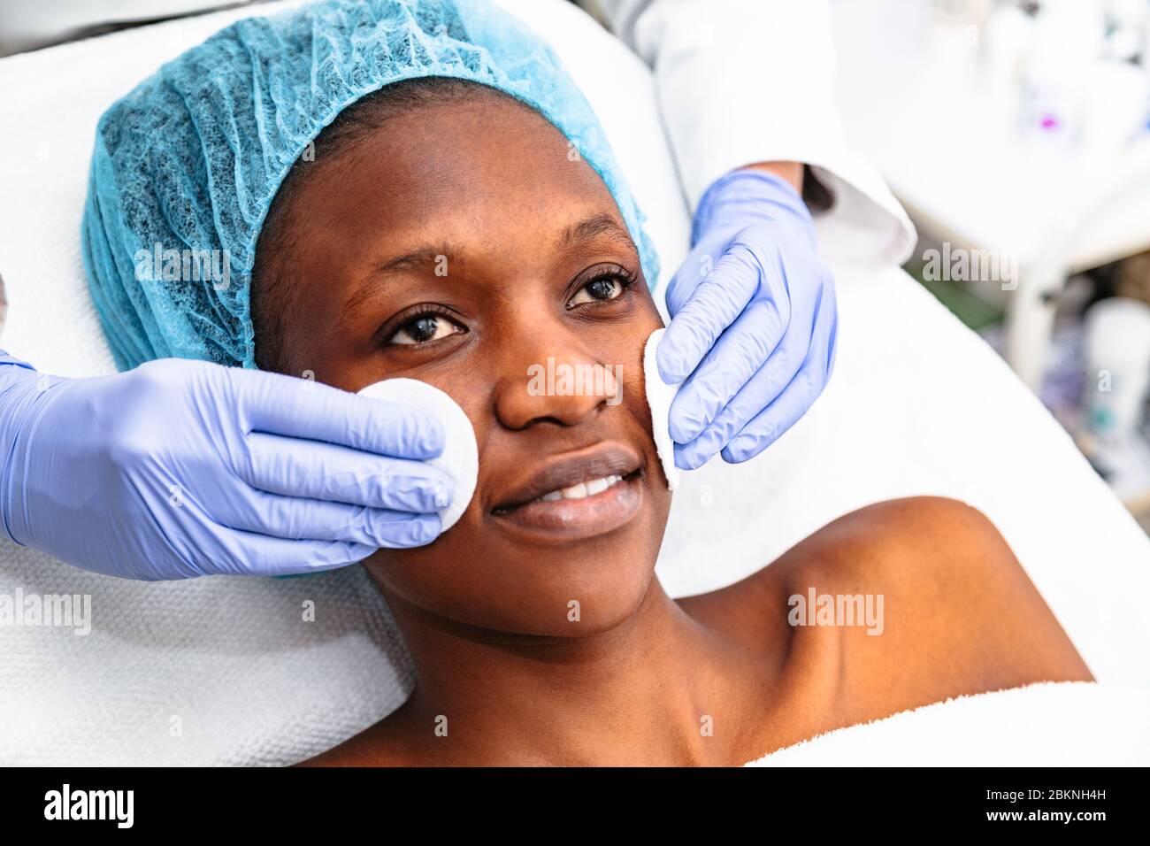 Young woman getting face procedure at salon Stock Photo - Alamy