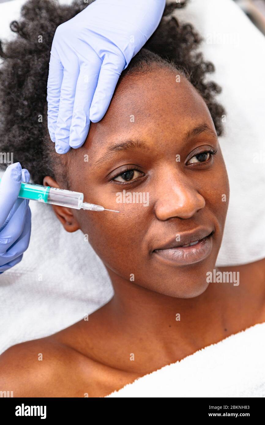 Woman receiving beauty plastic injection on her nose Stock Photo - Alamy