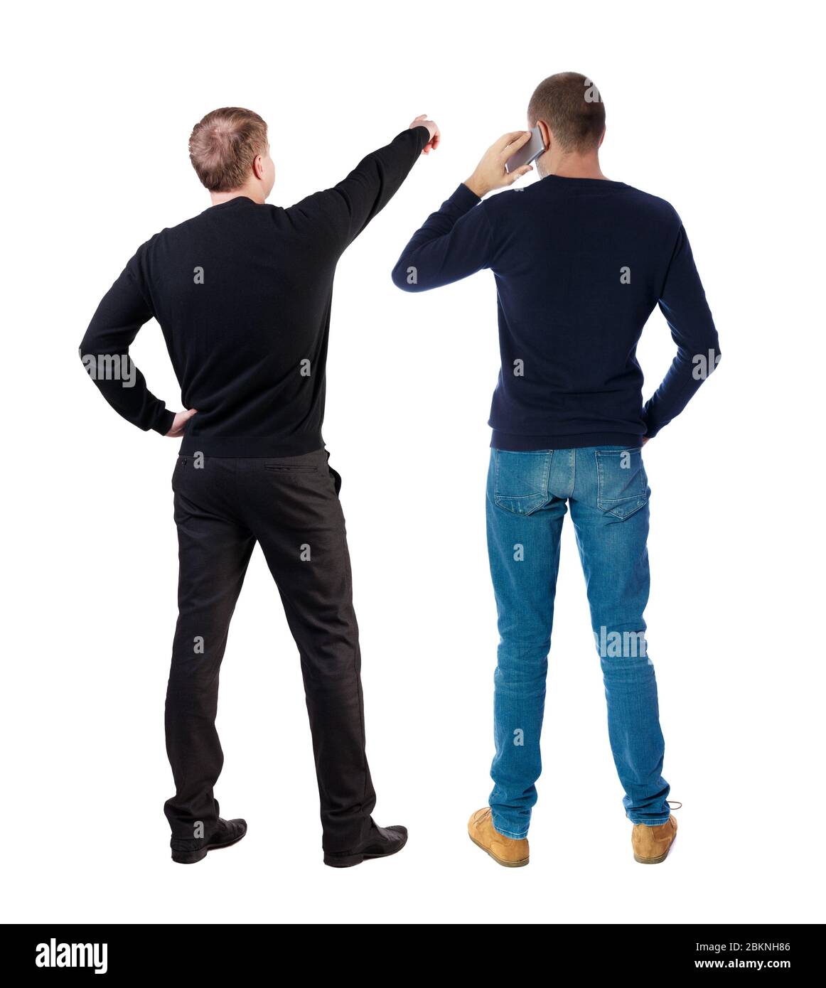Back view of two man in sweater with mobile phone. Rear view people ...