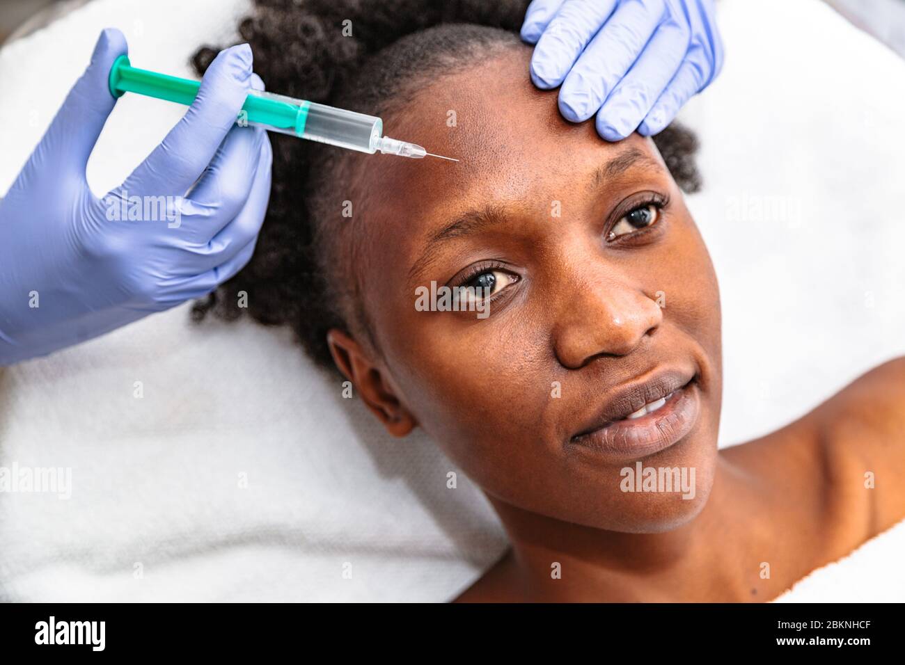 Young woman patient receiving plastic surgery injection Stock Photo - Alamy