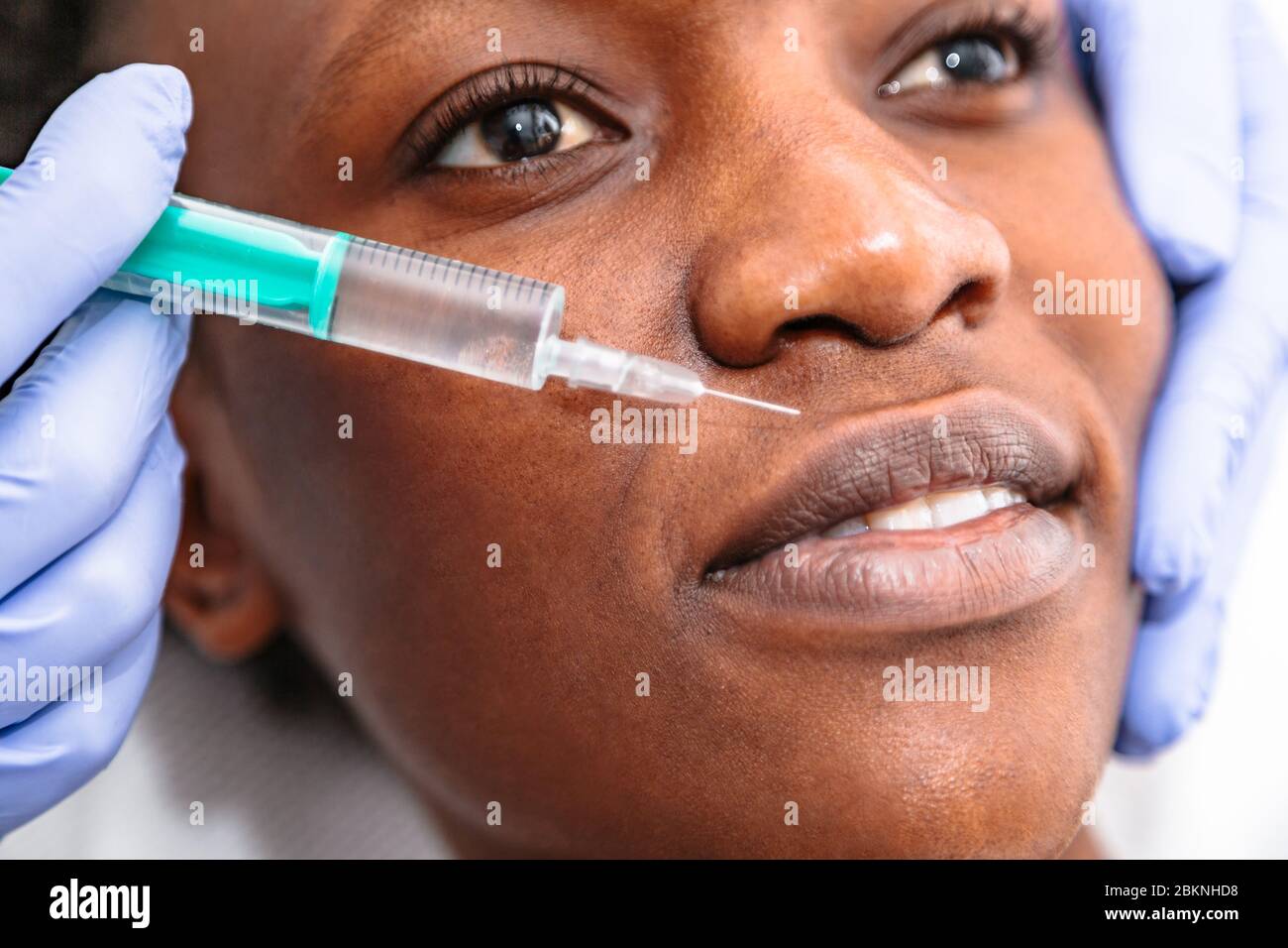 Cosmetic beauty injection to beautiful woman face Stock Photo - Alamy