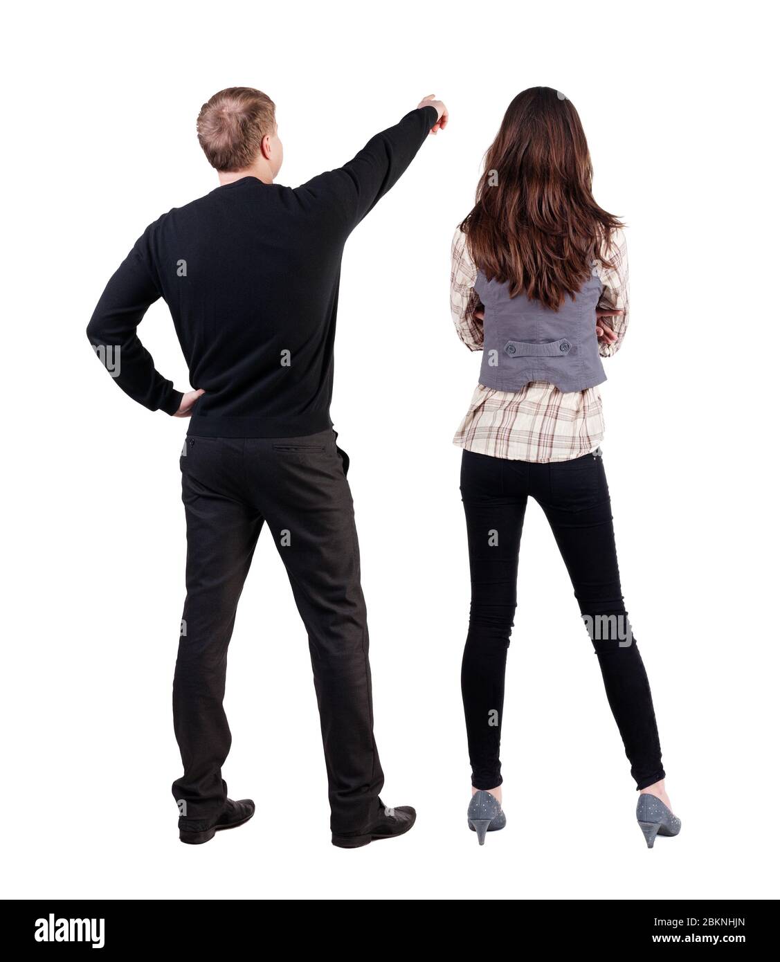 Back view of couple in sweater pointing. Rear view people collection ...