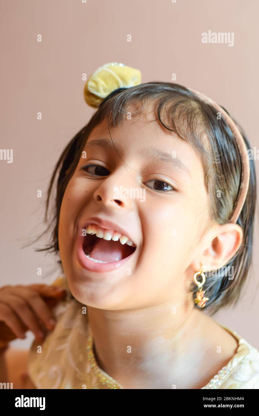 cheerful and cute girl smiling while looking at camera Stock Photo - Alamy