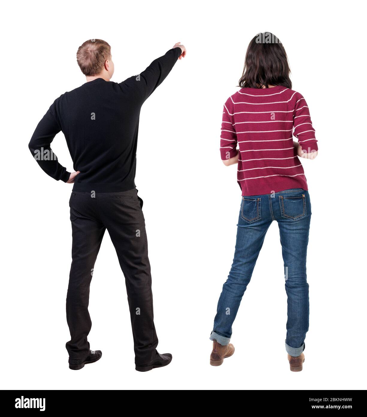 Back view of couple in sweater pointing. Rear view people collection ...