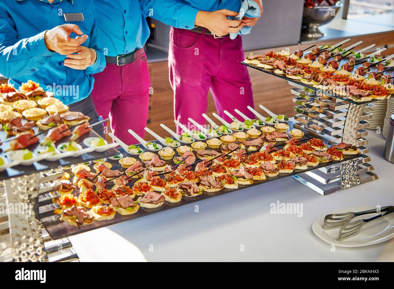 delicious buffet for guests, sandwiches, meat and beautiful waiters ...