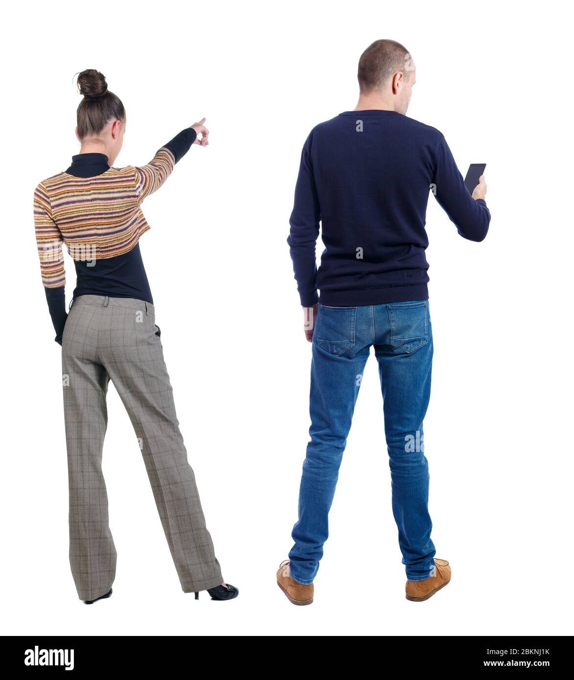Back view of couple in sweater with mobile phone. beautiful friendly ...